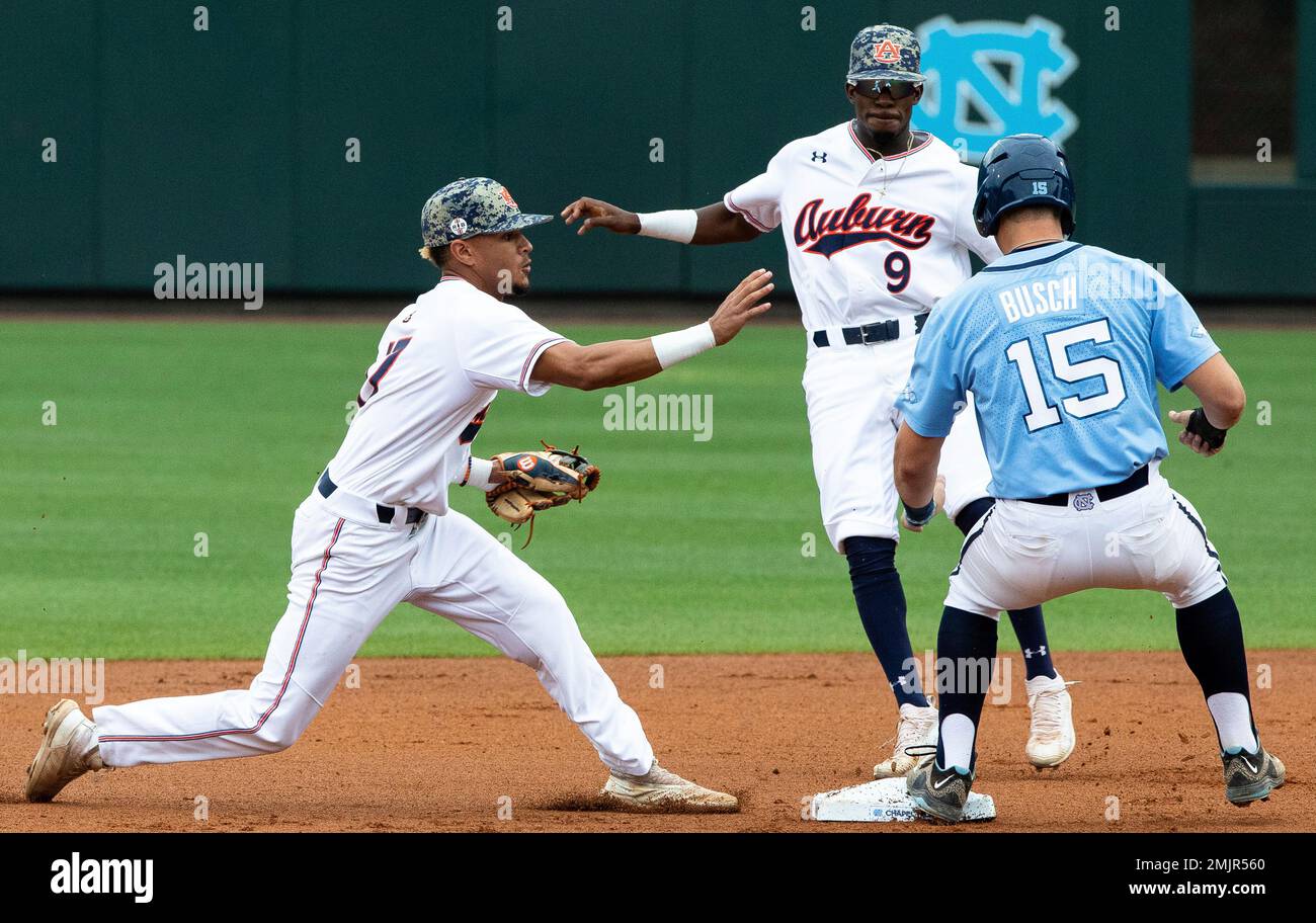 North Carolina's Michael Busch (15) safely returns to second base ahead ...