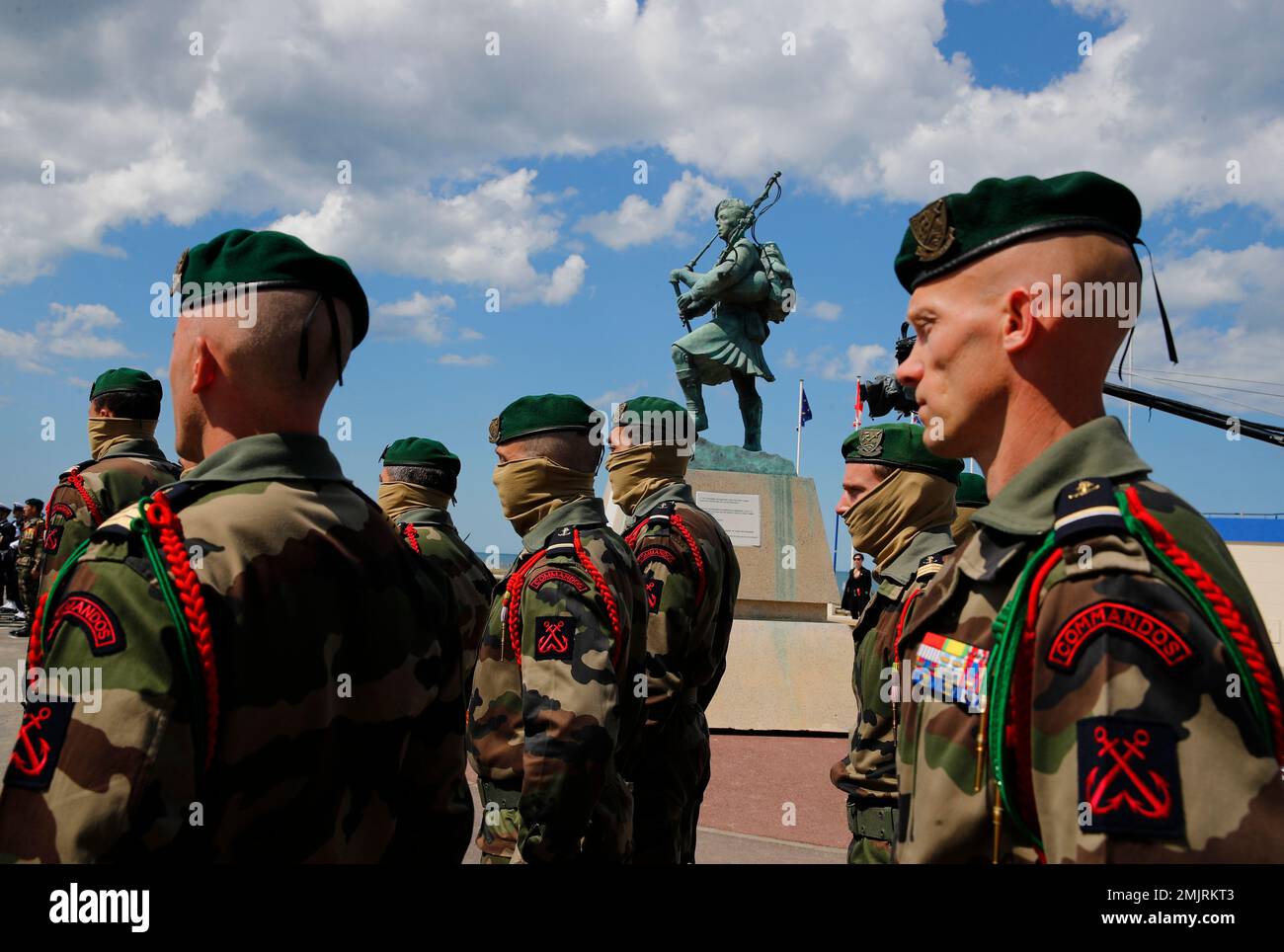 French soldiers of the navy commando wait before a ceremony Thursday ...