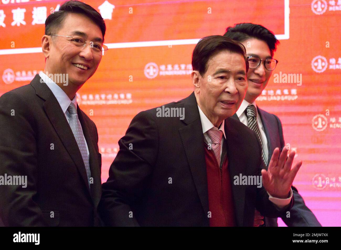 Henderson Land Development's founder and chairman Lee Shau-kee, center ...