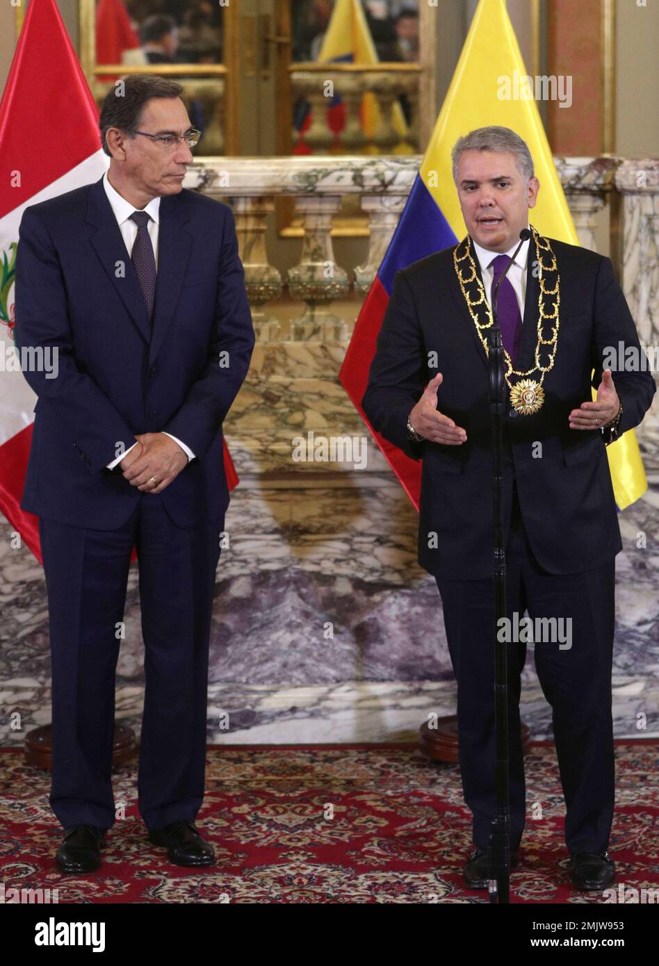 Colombia's President Ivan Duque speaks as Peru's President Martin ...