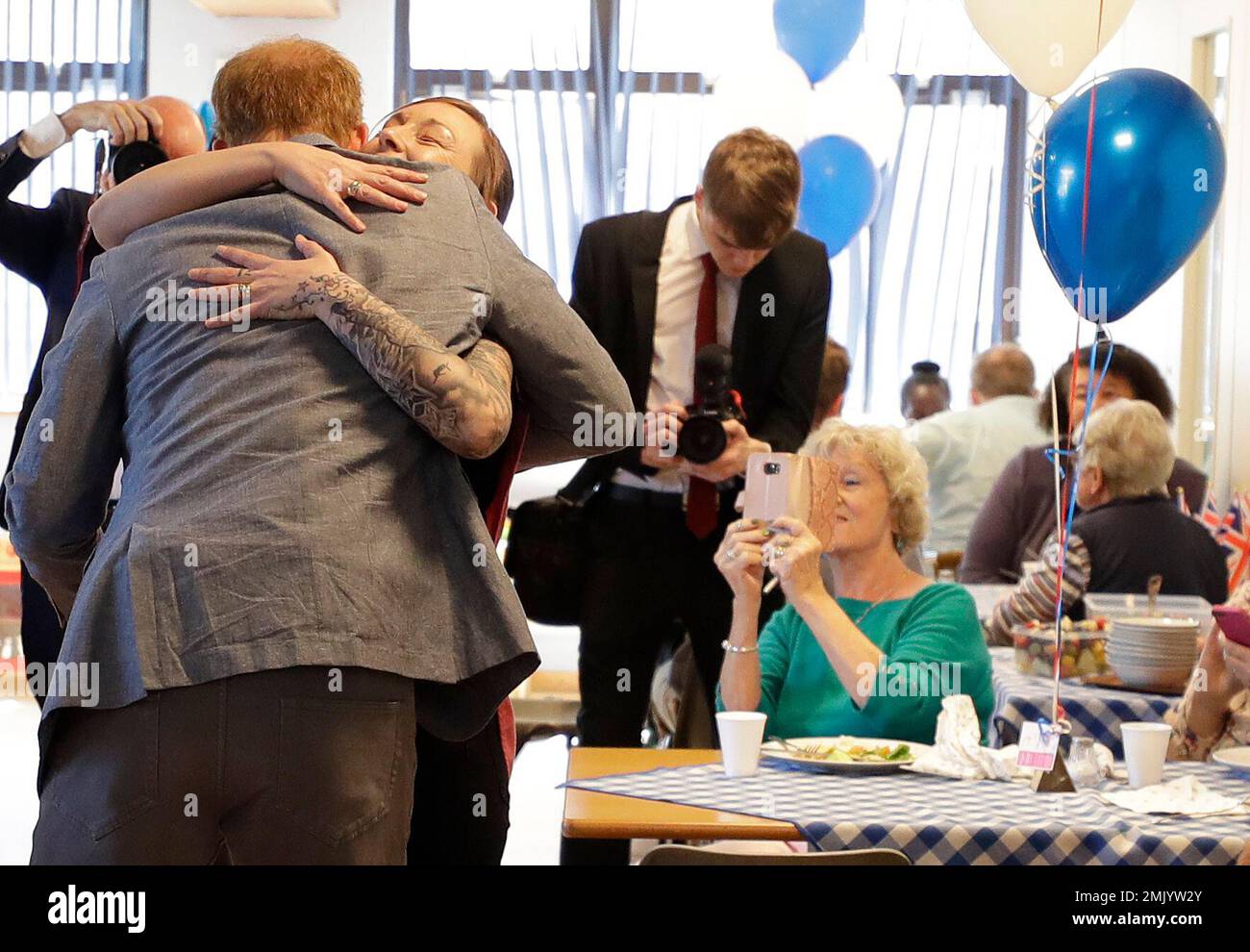 Britain's Prince Harry, The Duke of Sussex gets a hug as he visits the ...