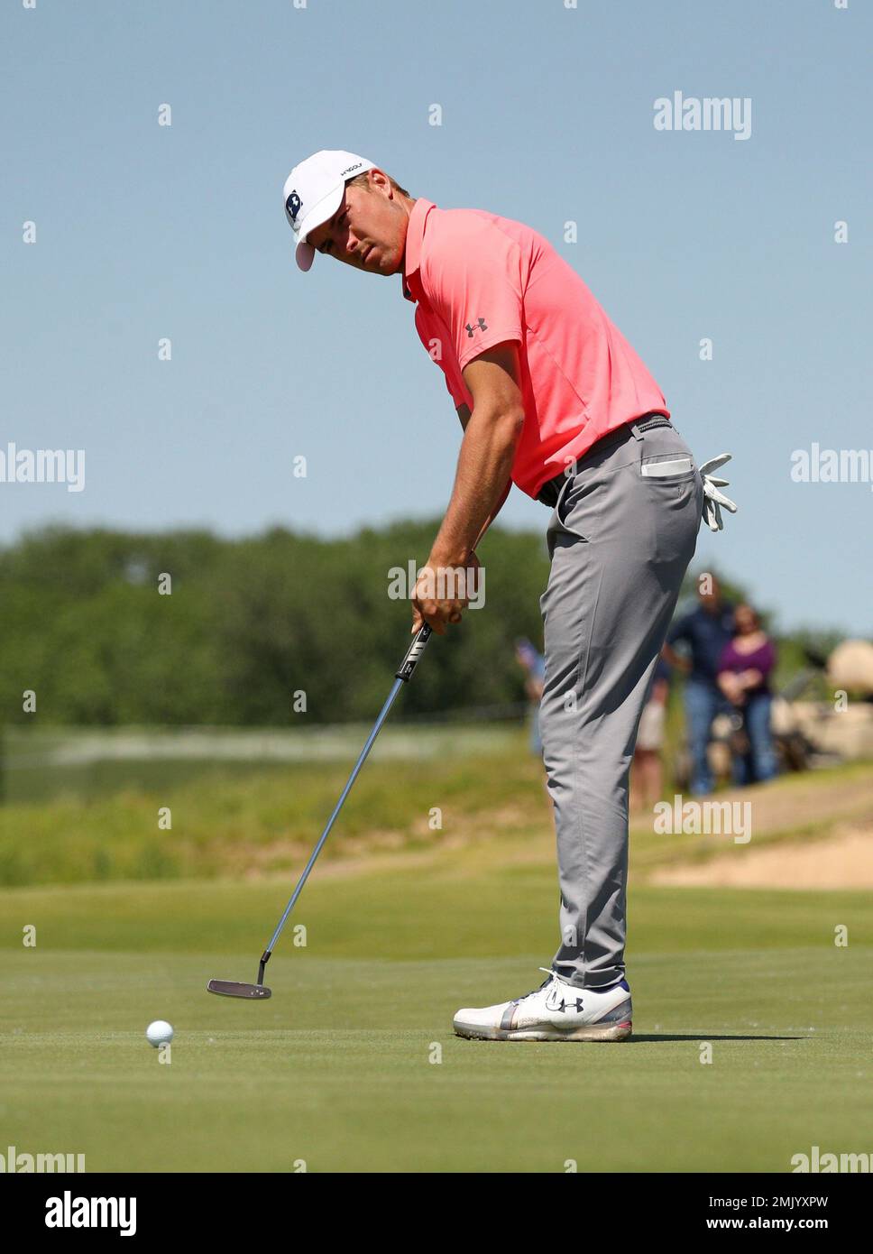 Jordan Spieth putts on the 10th green in the final round of the Byron ...