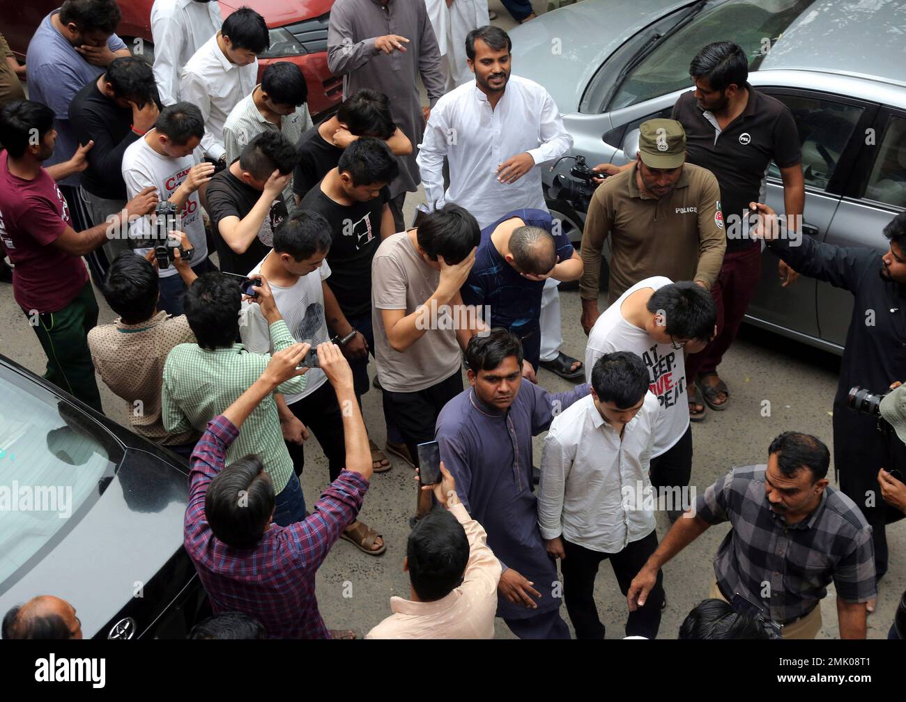 Detained Chinese nationals whose alleged involvement in a trafficking ...