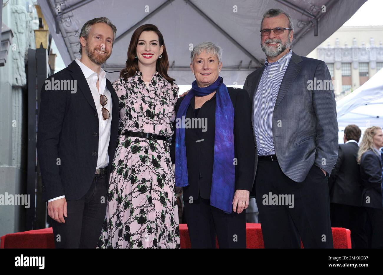 Actress Anne Hathaway, second left, poses with her family, from left ...