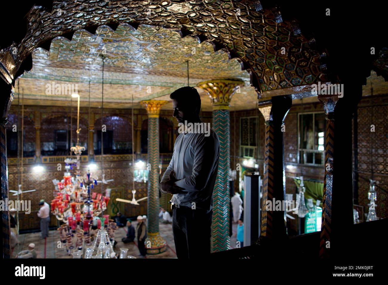 A Kashmiri man offer prayers inside Shah-e-Hamdan Mosque, one of the ...