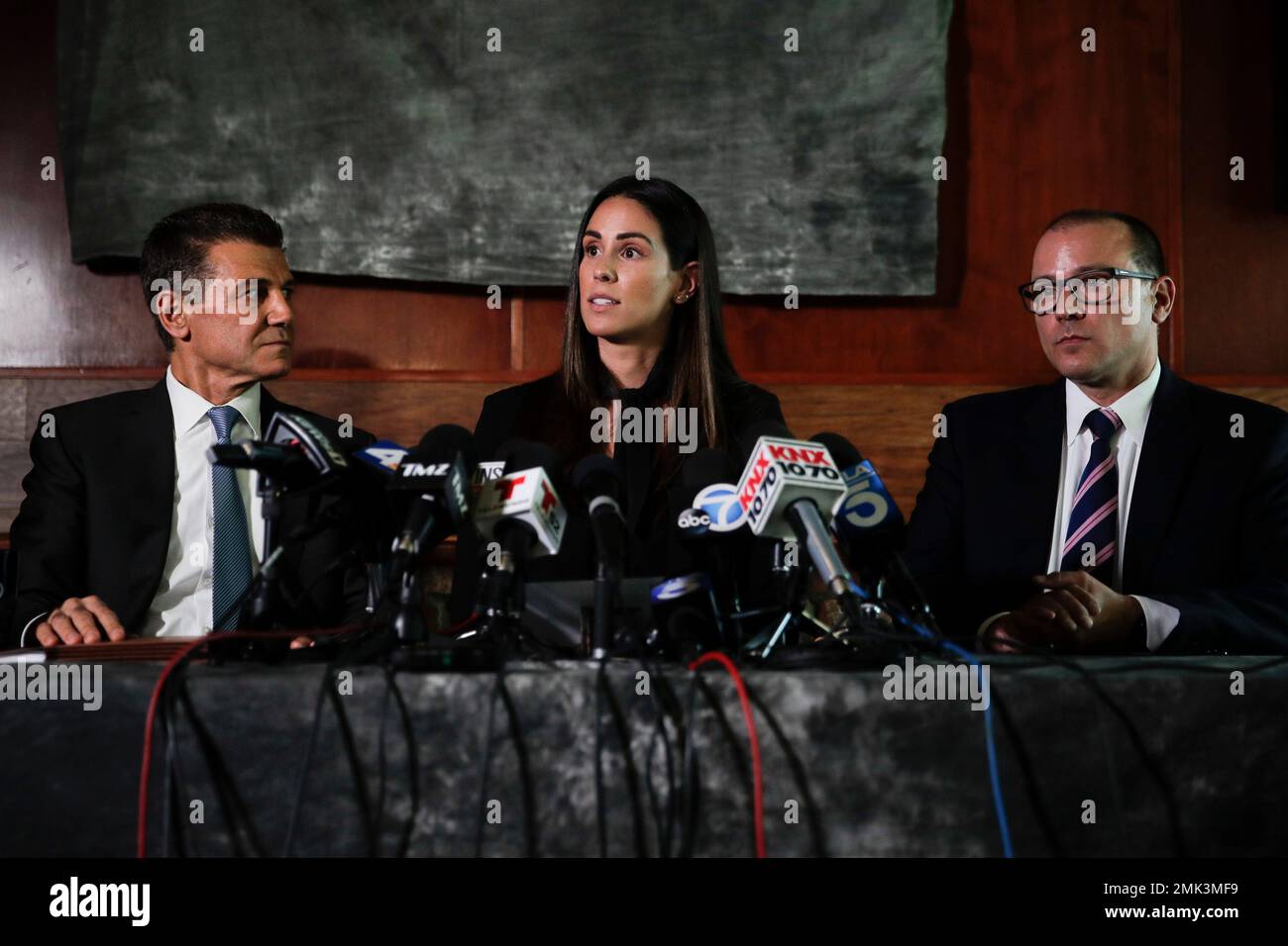 Former sports reporter Kelli Tennant, center, answers questions from ...