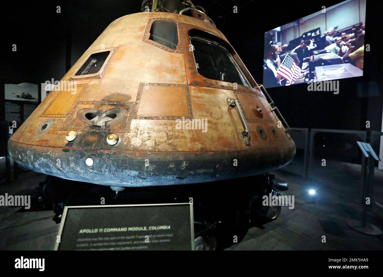 The NASA Apollo 11 command module Columbia, with videos running behind ...