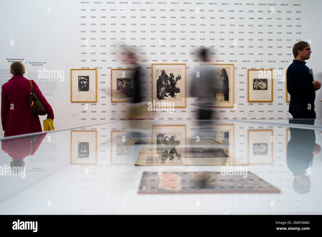 People watch graphic work of Emil Nolde during the press preview of an exhibition about the ...