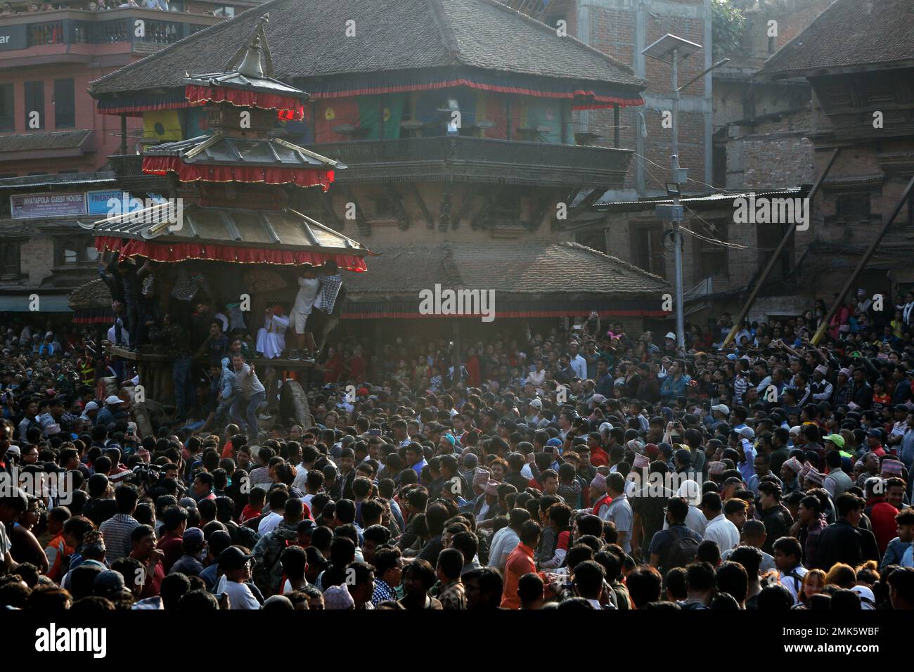 Nepalese devotees pull ropes tied to a chariot of Hindu god Bhairava ...