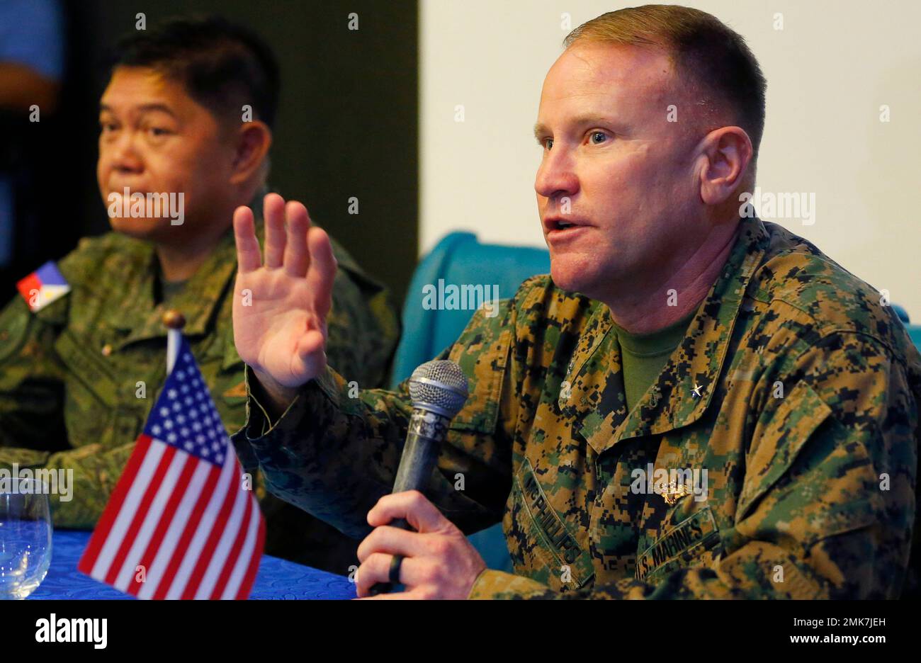 U.S. Brig. Gen. Christopher McPhillips, USMC, right, gestures during a ...