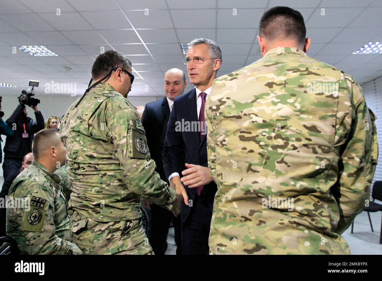 NATO Secretary General Jens Stoltenberg, centre, and Georgian Prime ...