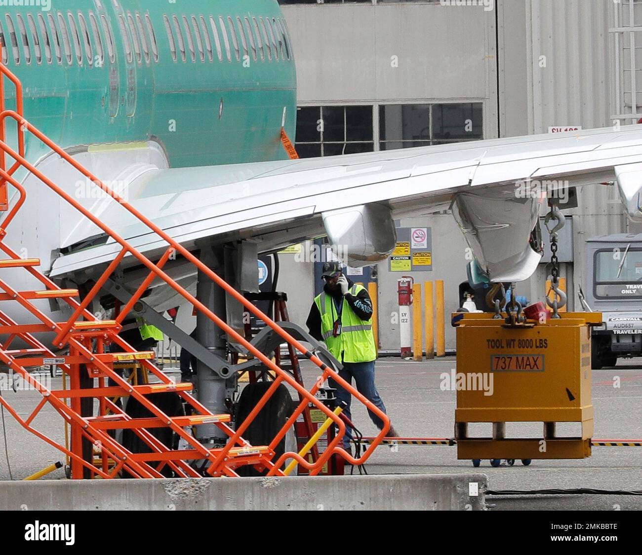 A worker stands near a Boeing 737 MAX 8 being built for for Ethiopian ...