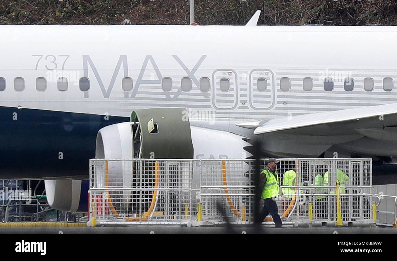 Workers stand near a Boeing 737 MAX 9 airplane at Boeing Co.'s Renton ...