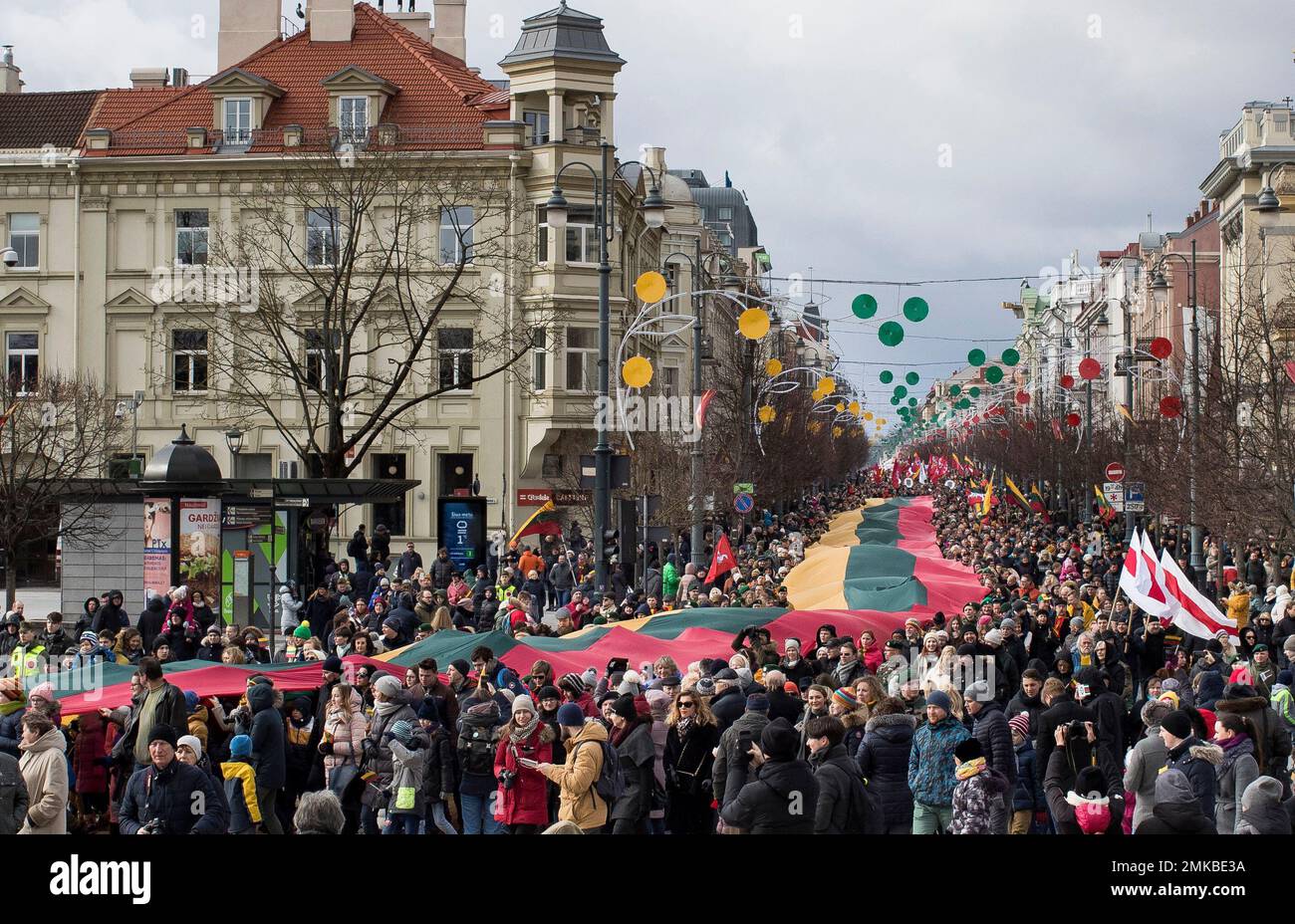 People carry a giant Lithuanian flag during a celebration of Lithuania ...