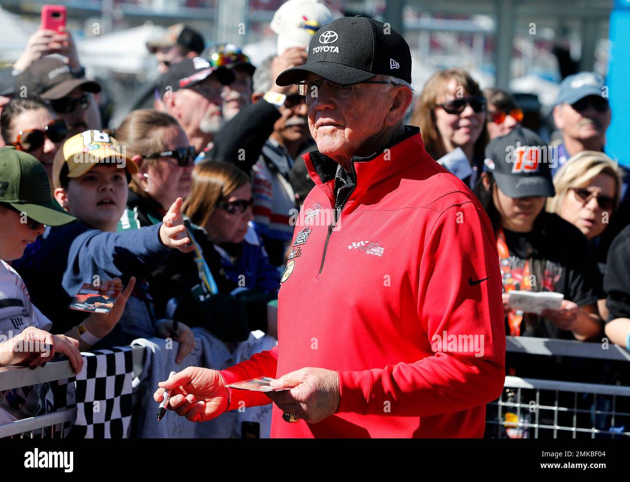 Team owner Joe Gibbs signs autographs for fans prior to the start of ...