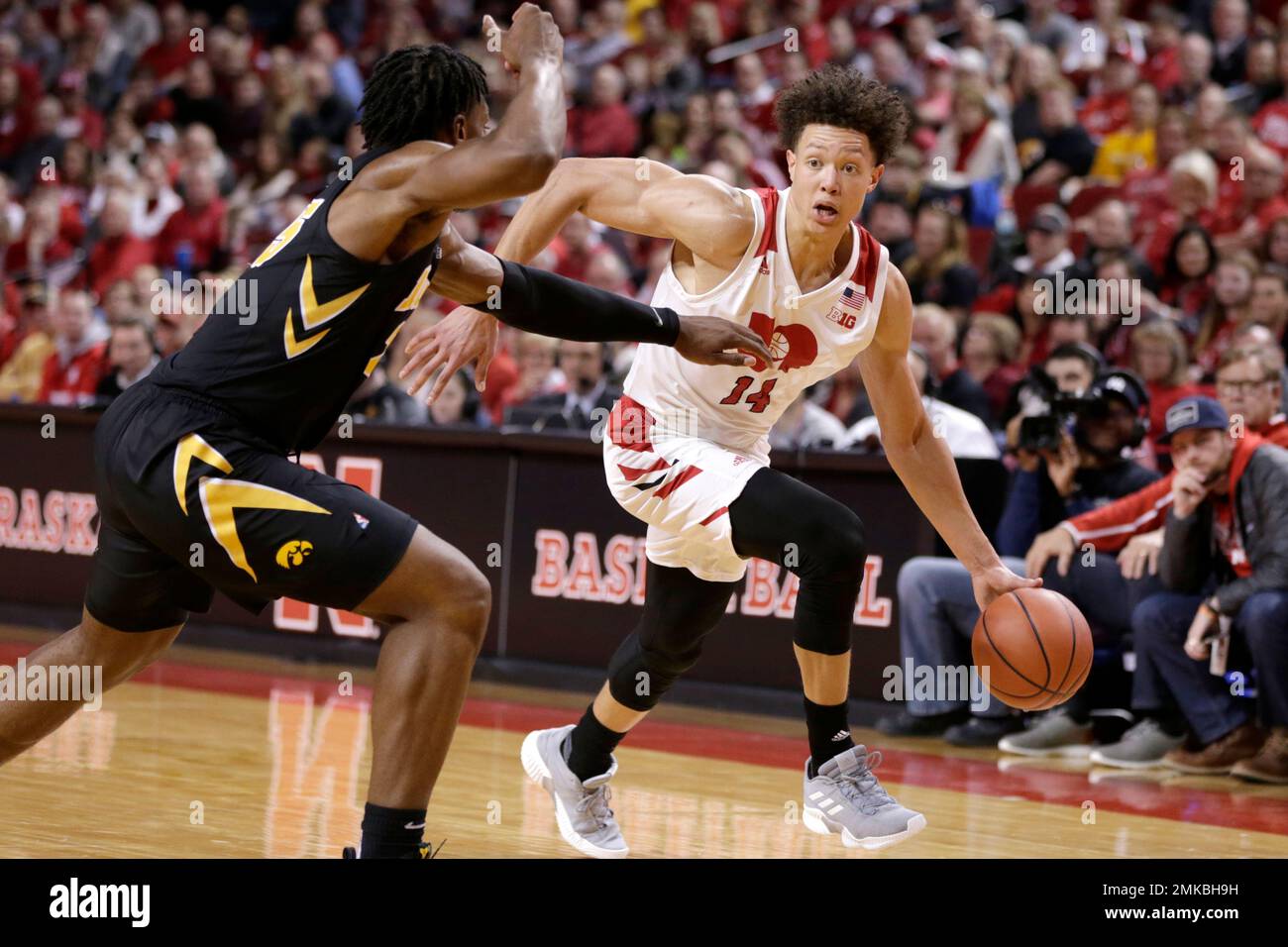 Nebraska's Isaiah Roby (14) drives to the basket against Iowa's Tyler ...