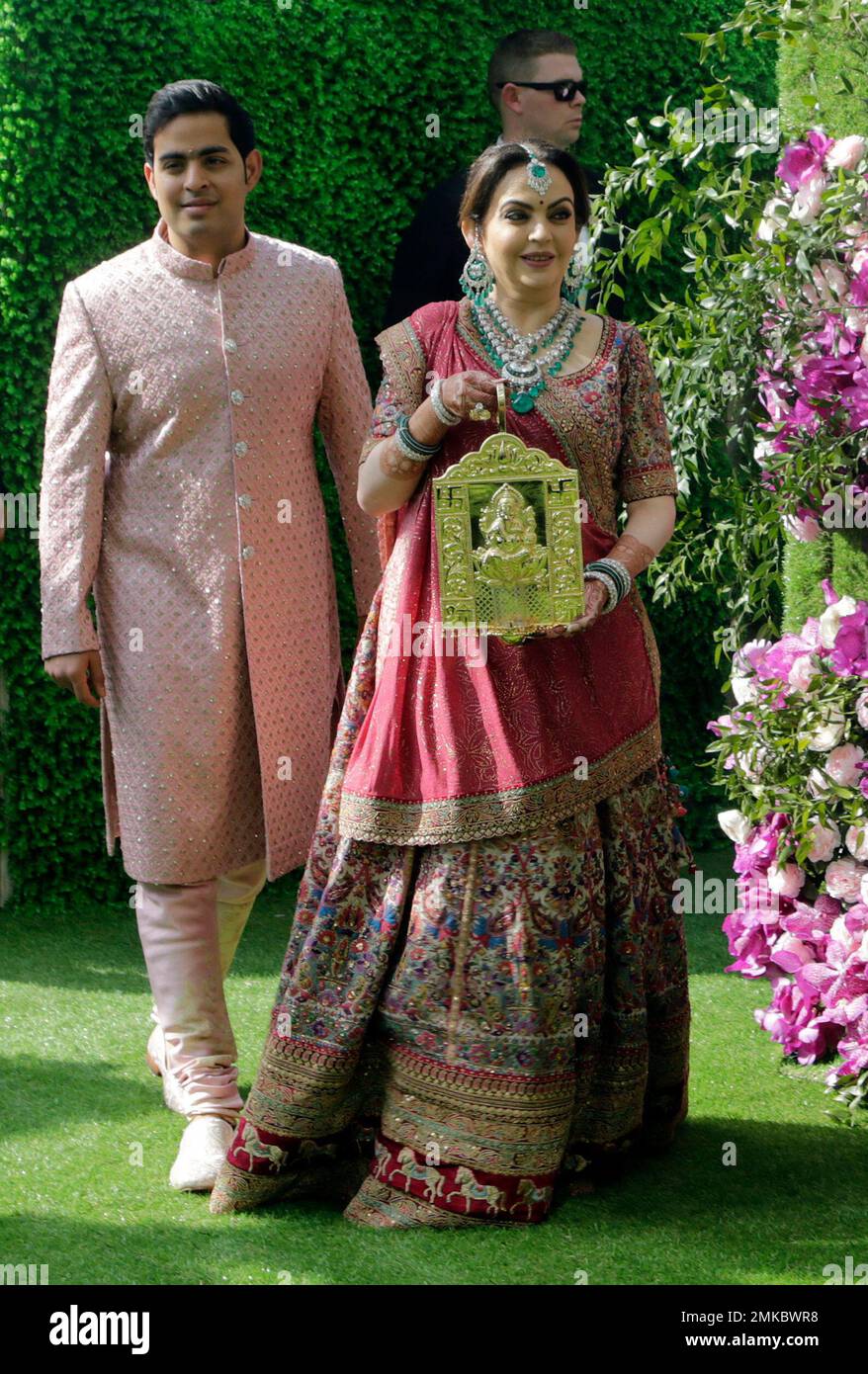 Nita Ambani, wife of Reliance Industries Chairman Mukesh Ambani, arrives with her son Akash ...