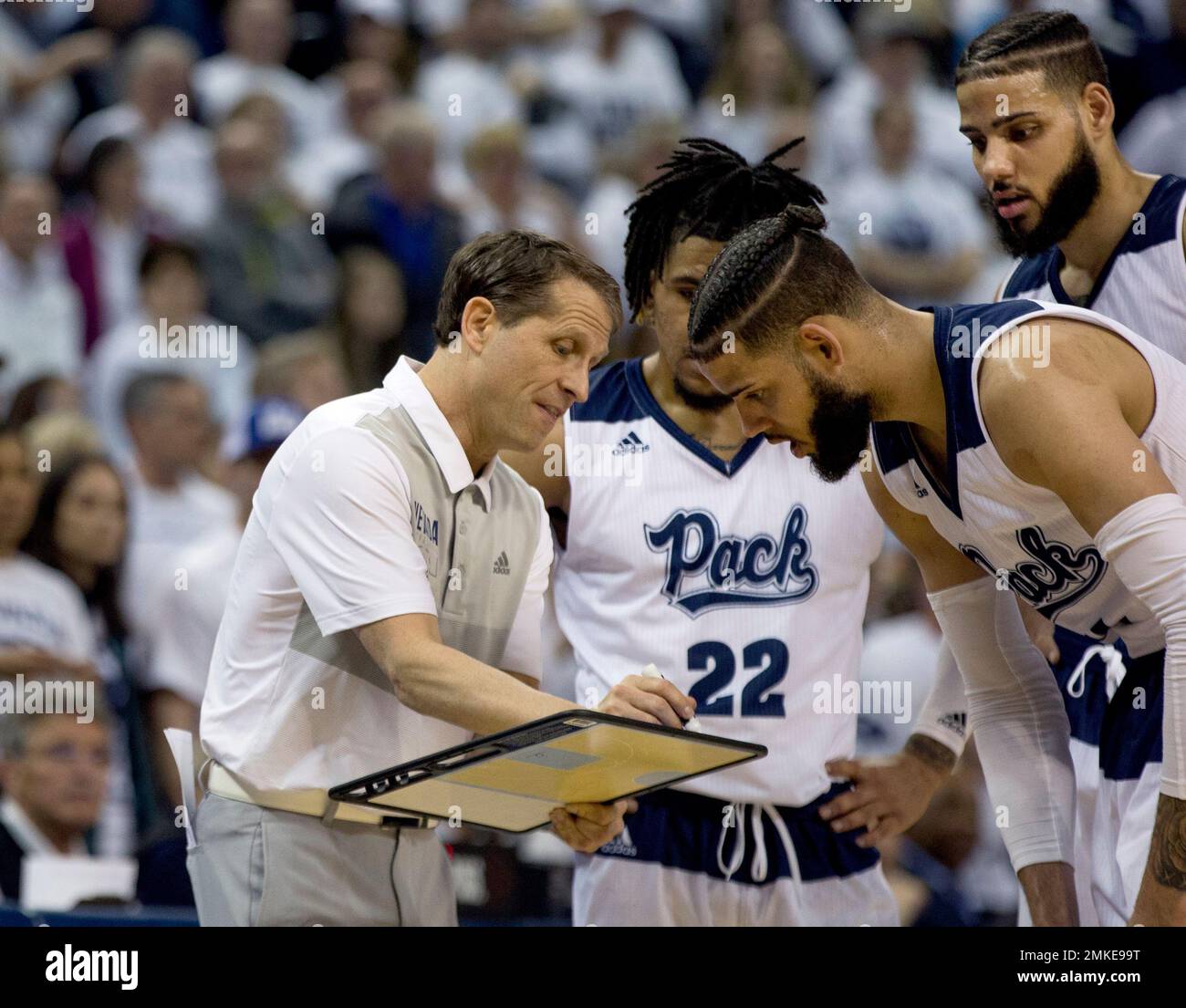 Nevada head coach Eric Musselman draws up a play against Fresno State ...
