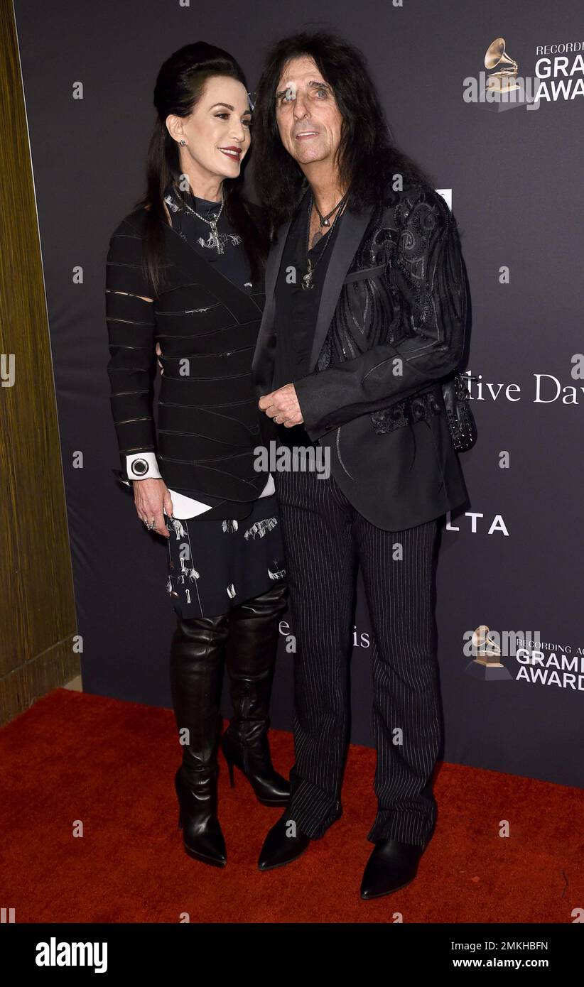 Alice Cooper, right, and Sheryl Goddard arrive at the Pre-Grammy Gala ...