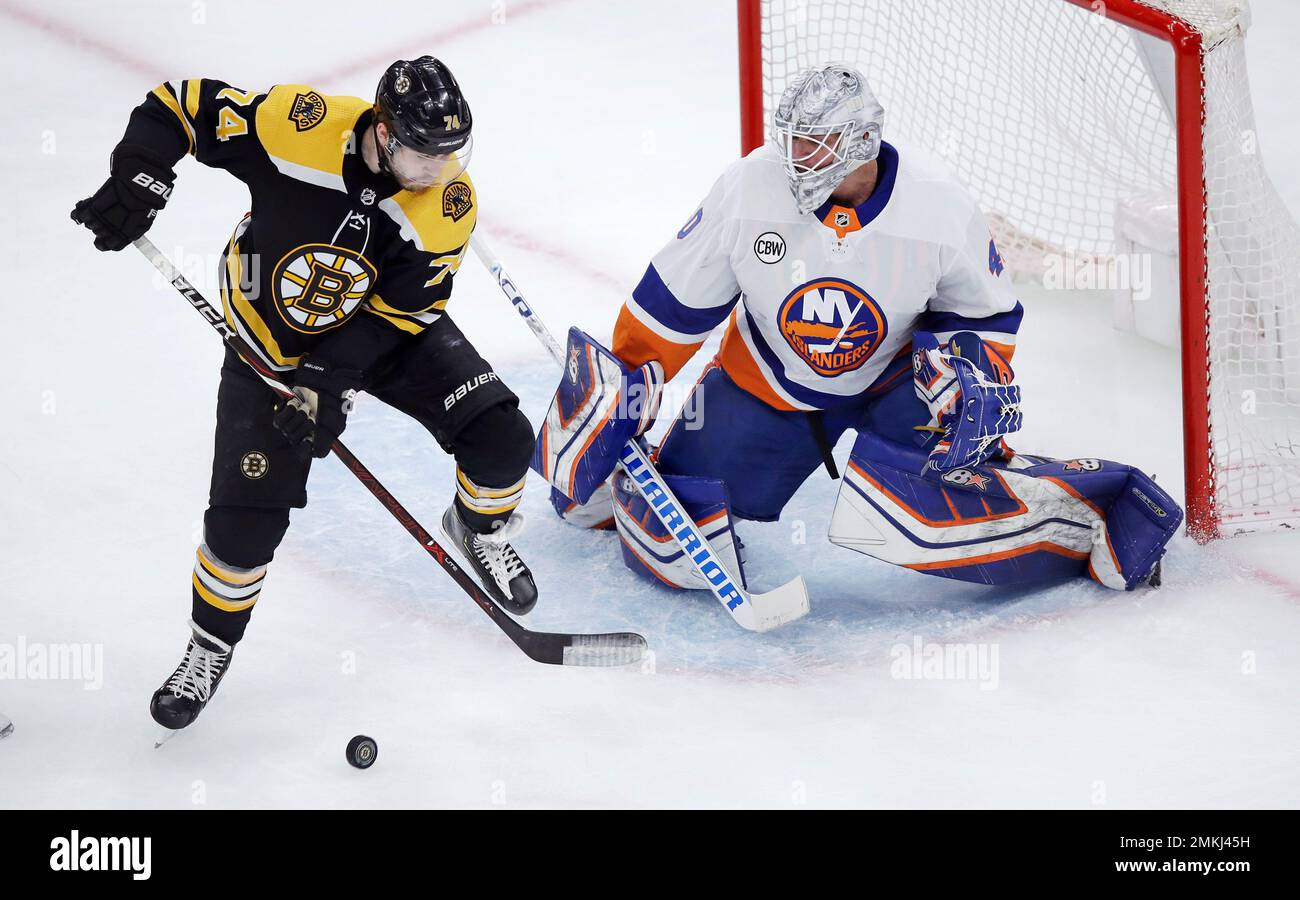 Boston Bruins left wing Jake DeBrusk (74) looks for the rebound after a ...