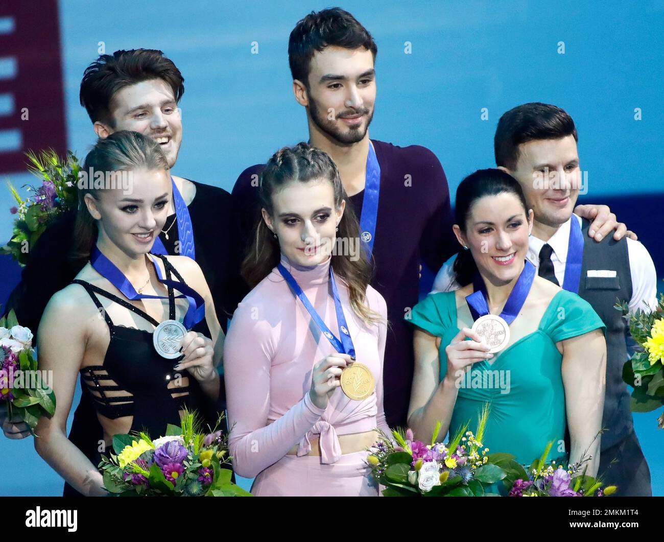 From left: second placed Alexandra Stepanova and Ivan Bukin of Russia ...