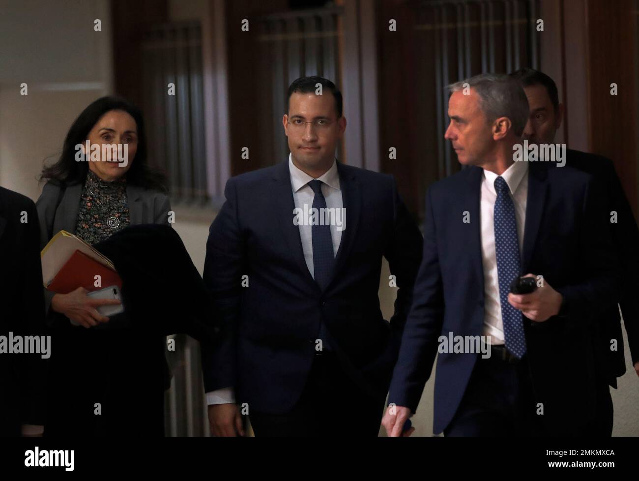 Former President Macron's security aide Alexandre Benalla, center ...