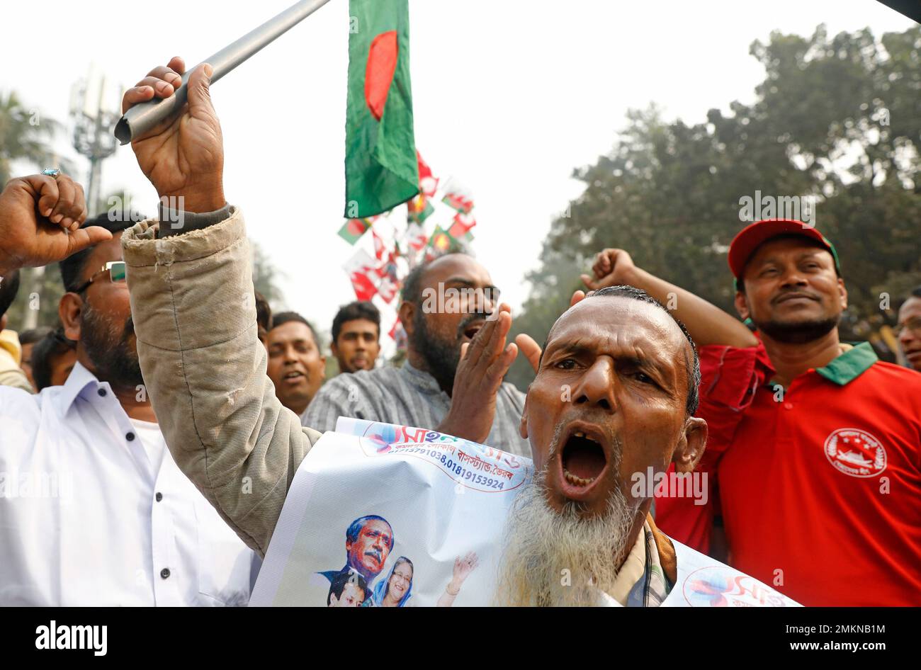 Supporters of Awami League political party shout slogans as they rally ...
