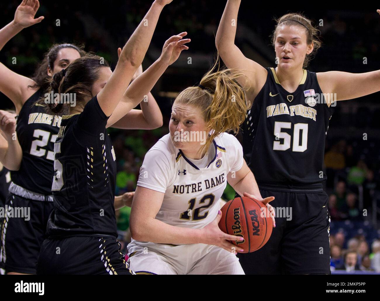 Notre Dame's Abby Prohaska (12) gets press from Wake Forest players ...