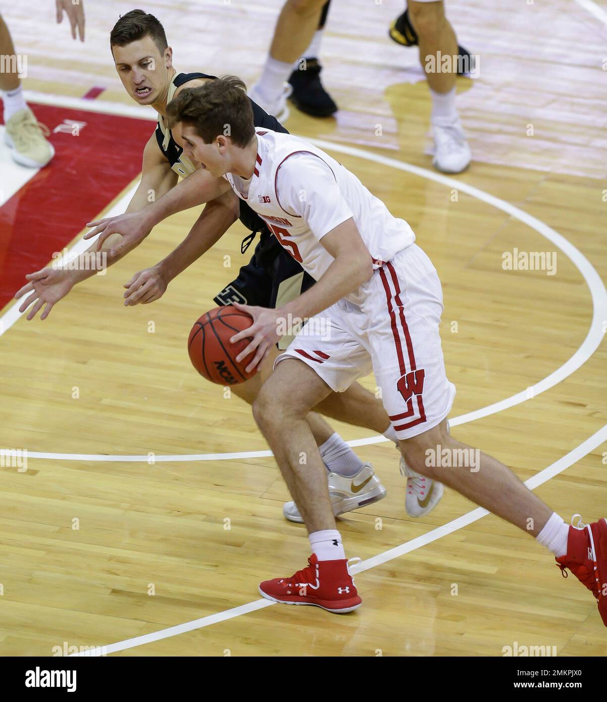 Wisconsin's Nate Reuvers (35) drives against Purdue's Grady Eifert ...