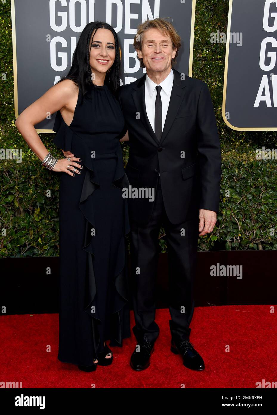 Willem Dafoe, right, and Giada Colagrande arrive at the 76th annual ...