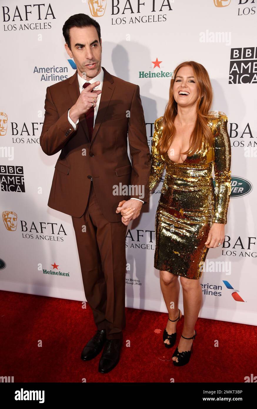 Actor/comedian Sacha Baron Cohen, left, and his wife, actress Isla ...