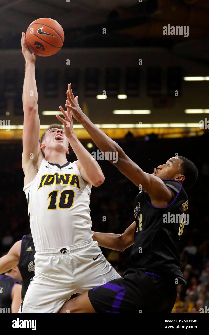 Iowa guard Joe Wieskamp (10) is fouled by Western Carolina guard ...