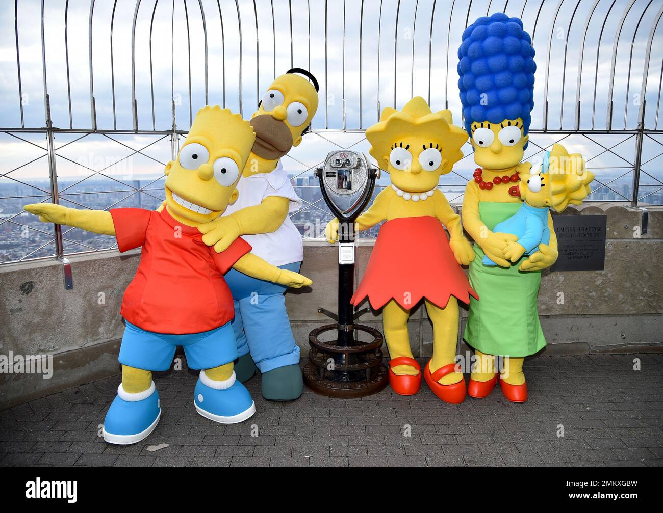 Costumed characters, from left, Bart Simpson, Homer Simpson, Lisa ...