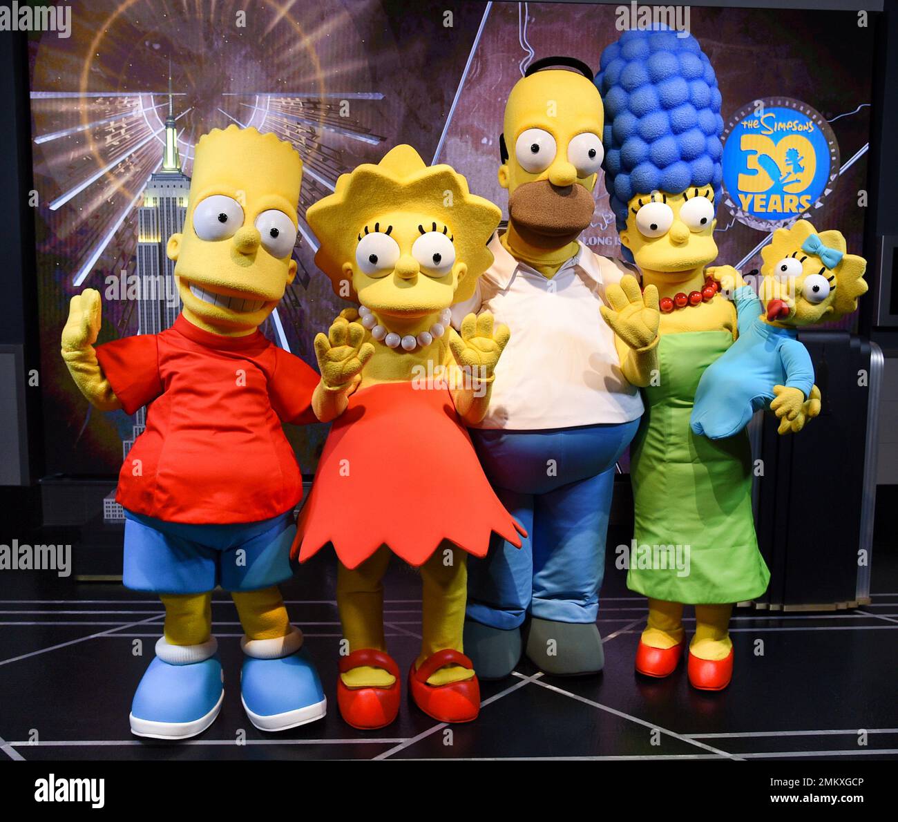 Costumed characters Lisa Simpson, left, Homer Simpson, Marge Simpson ...