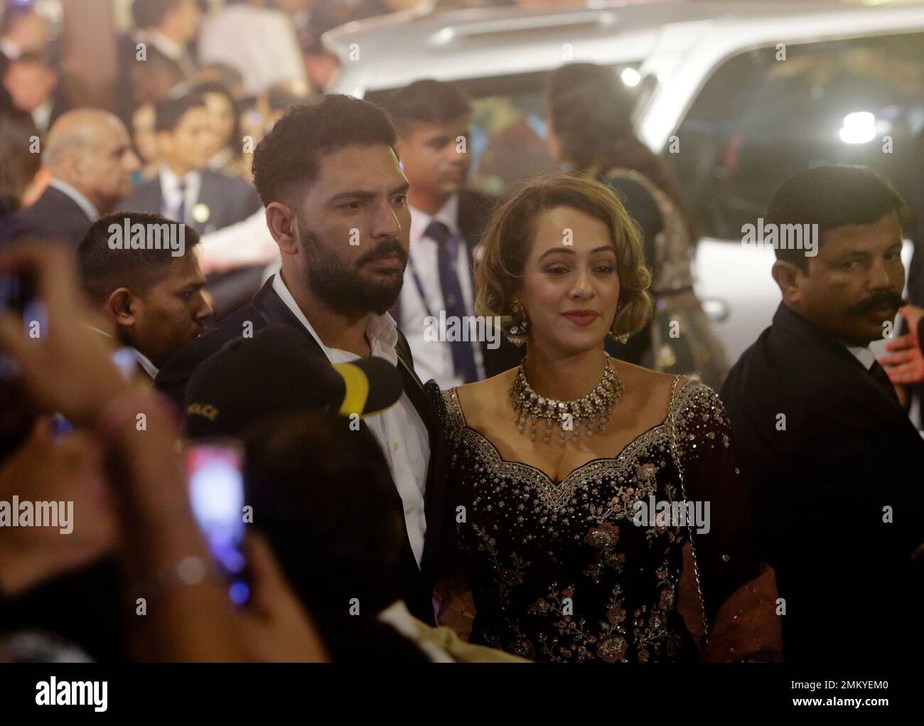 Indian cricket player Yuvraj Singh and his wife Hazel Keech arrive to ...