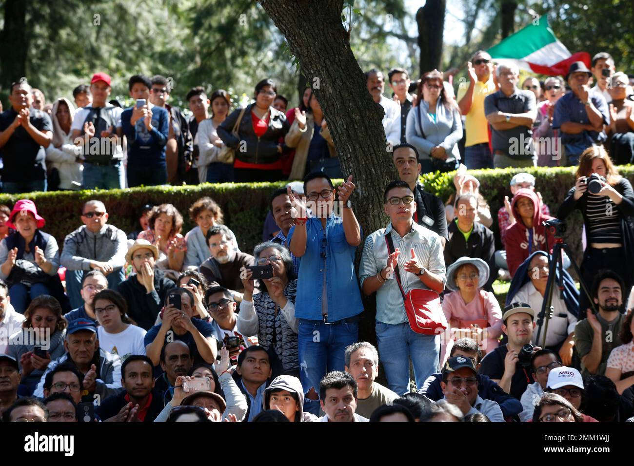 Visitors watch the presidential inauguration ceremony on an outdoor ...