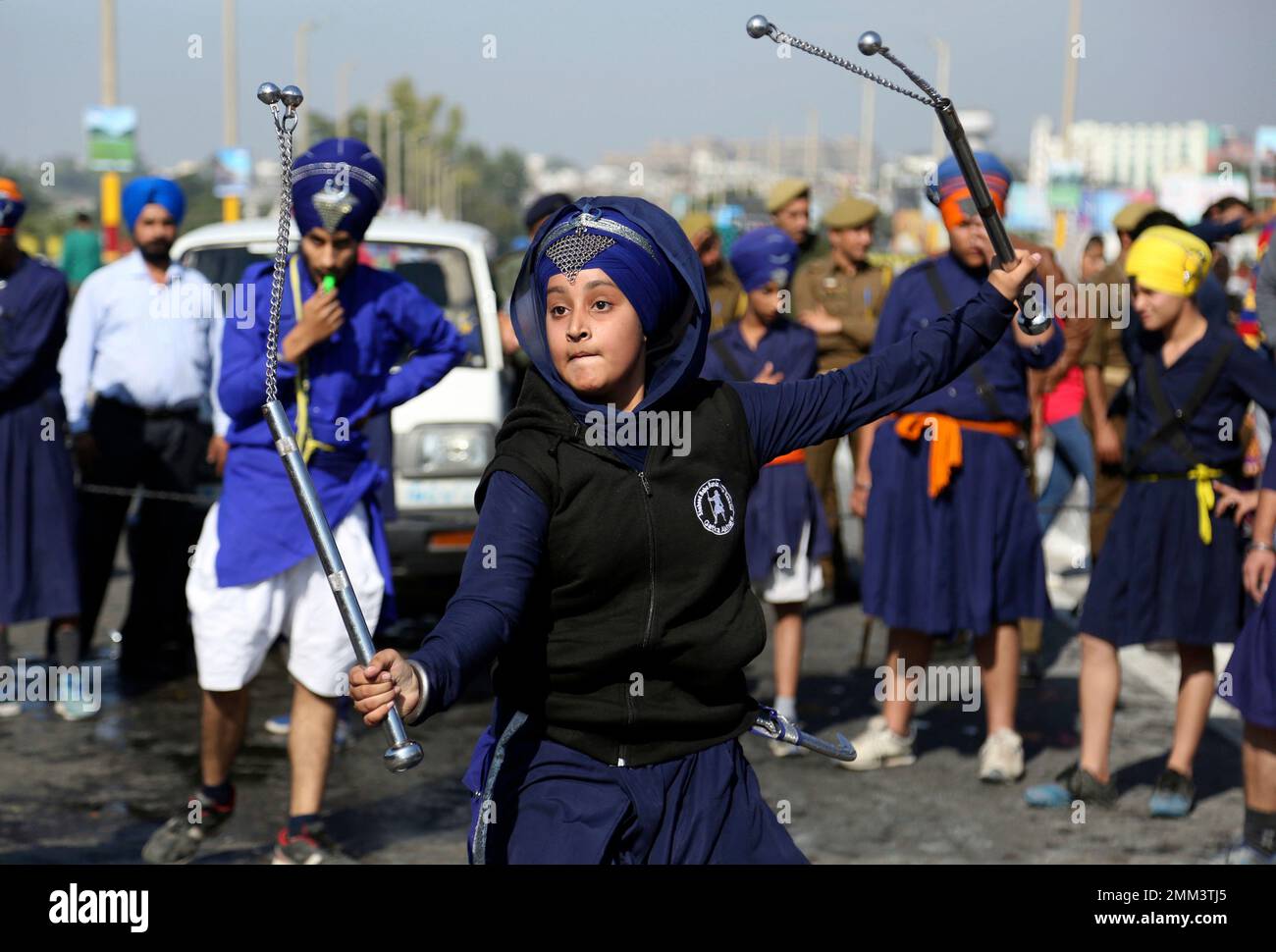 An Indian Sikh girl displays traditional martial art skills during a ...