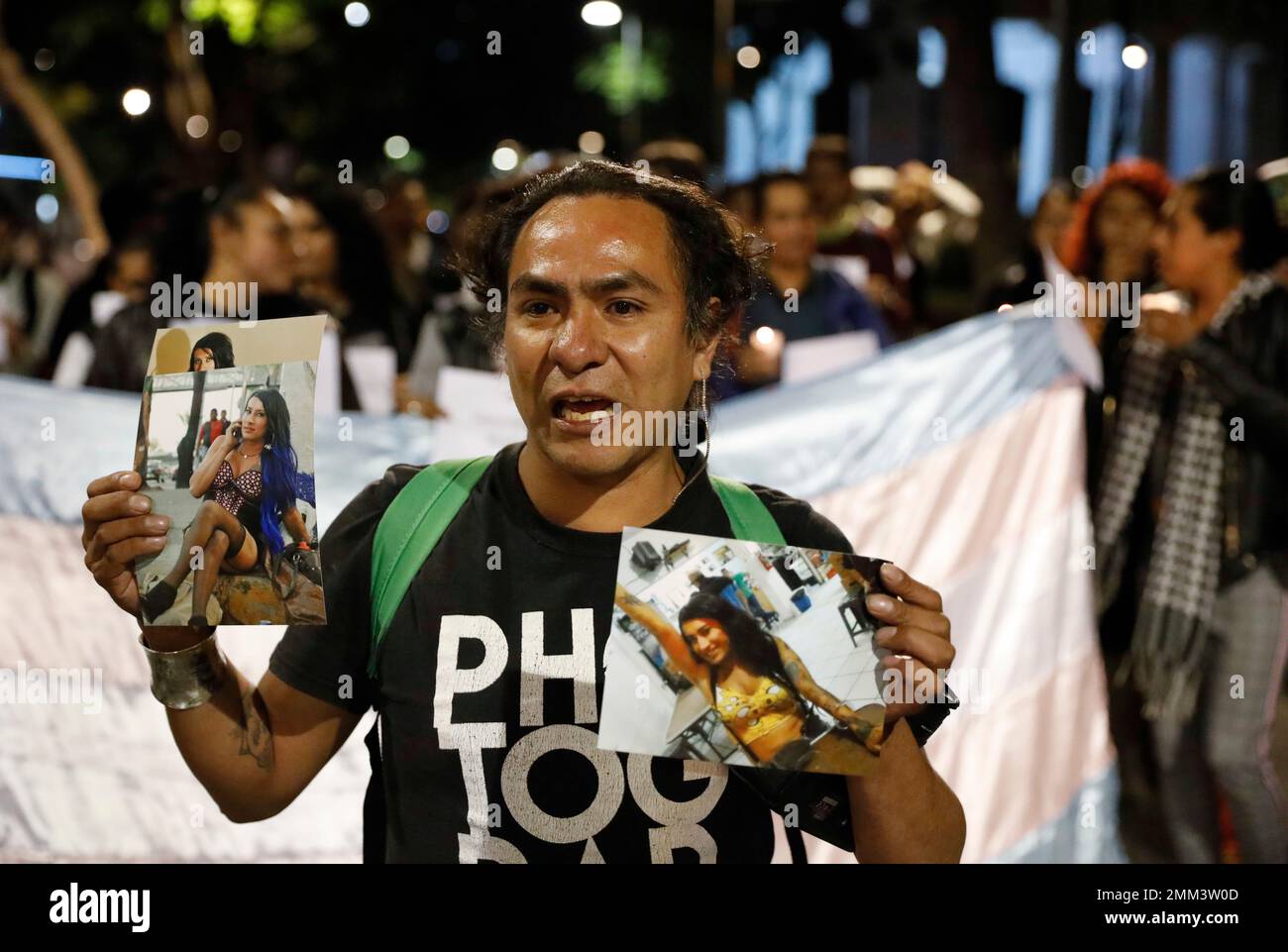 People carry photos of murdered transgender women as dozens of ...