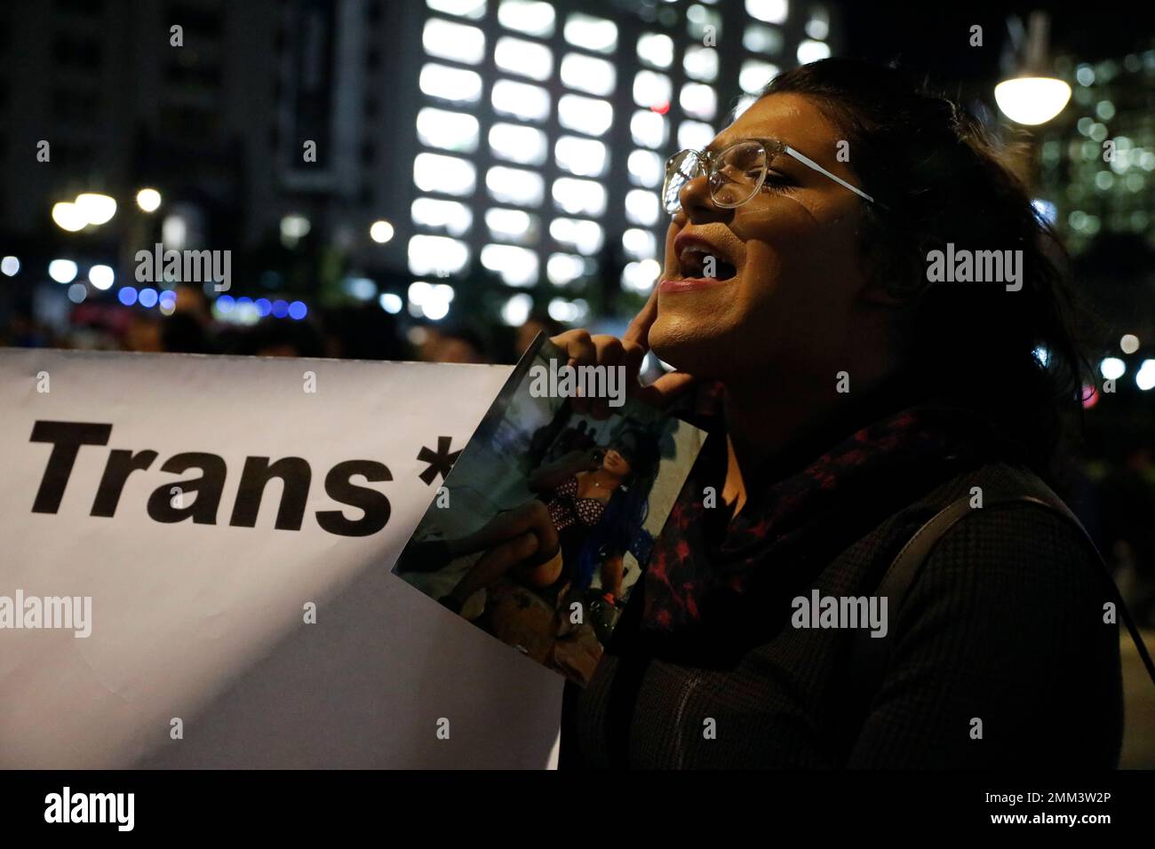 People chant as dozens of transgender women and allies gather to ...