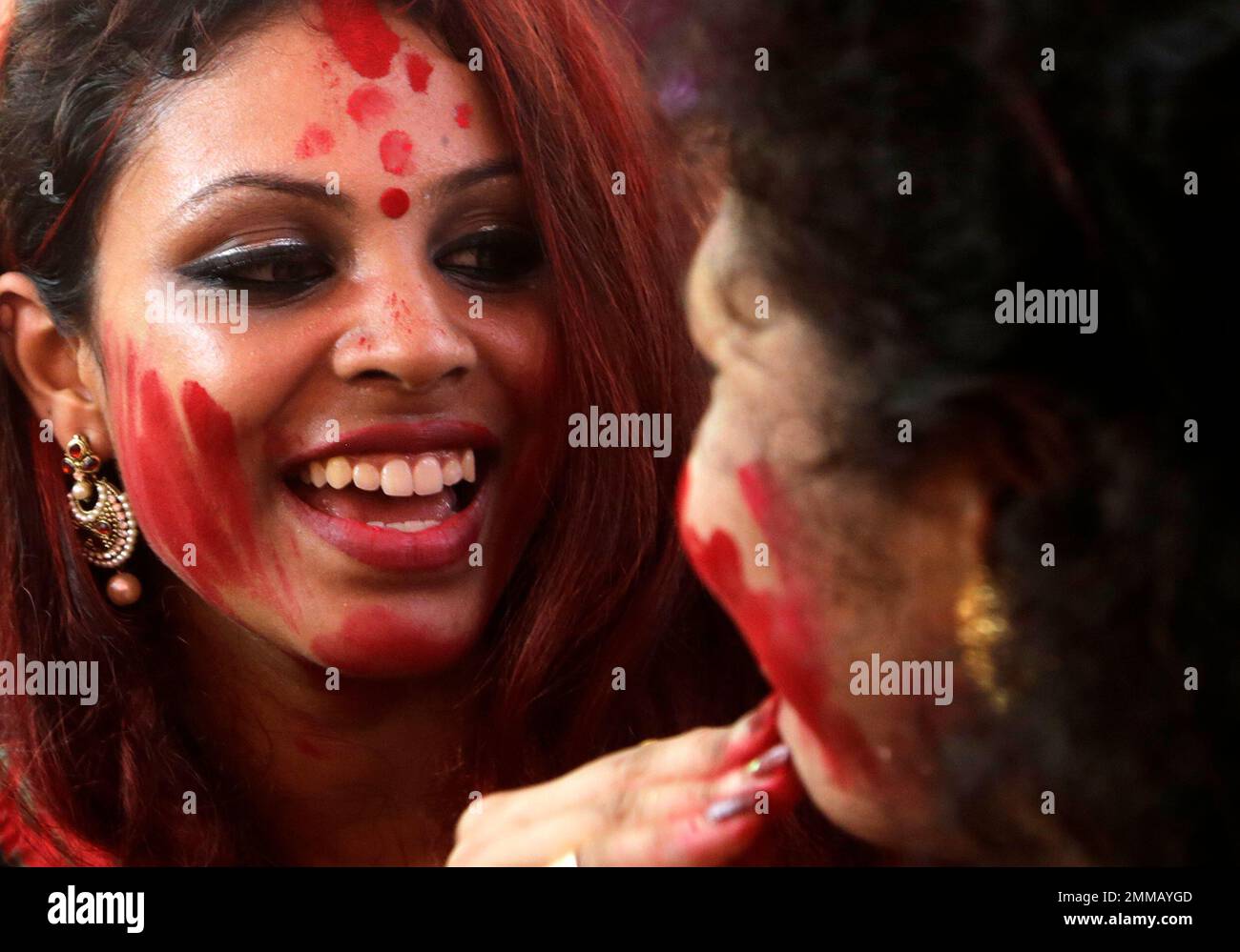 Indian women smear vermilion powder on each other during Vijayadashmi ...