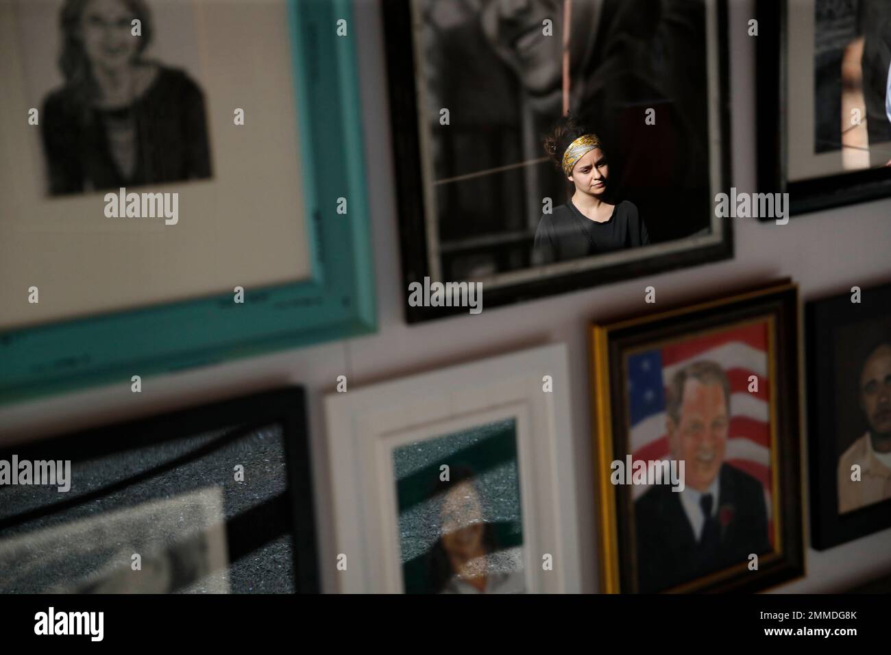 FILE - In this Sept. 25, 2018 file photo, a woman looks at painted ...
