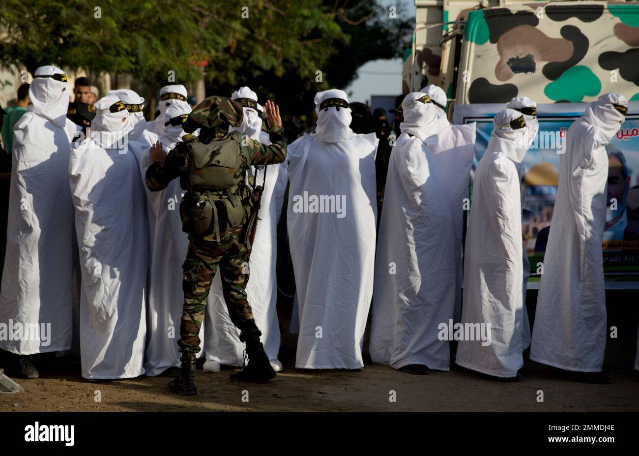 Palestinian members of the Al-Quds Brigades, the military wing of the ...