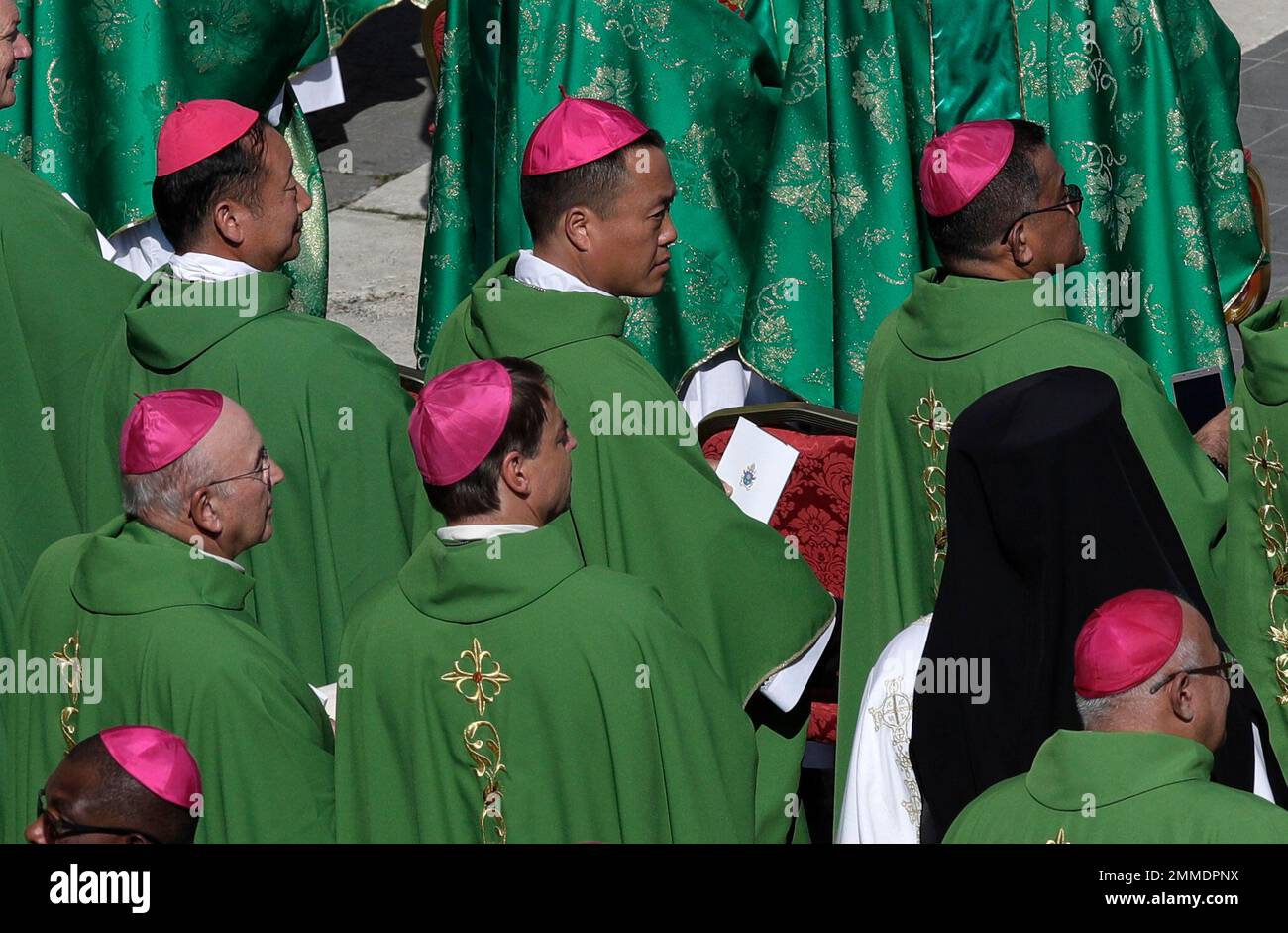 Chinese bishops Yang Xiaoting, top left, flanked by Guo Jincai, attend ...