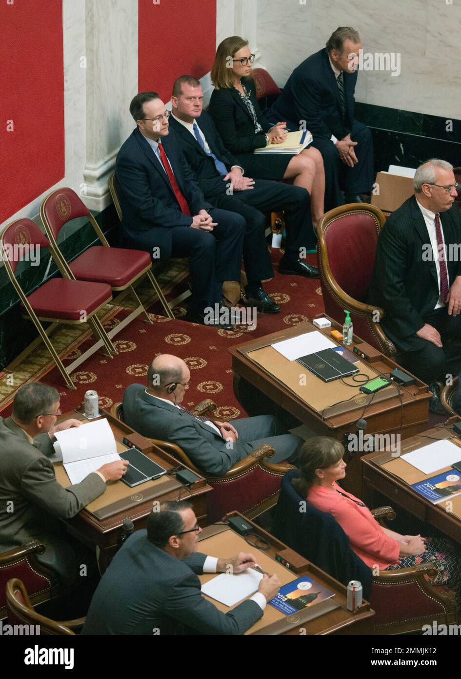 West Virginia Supreme Court justice, Allen Loughry, top left, listens ...