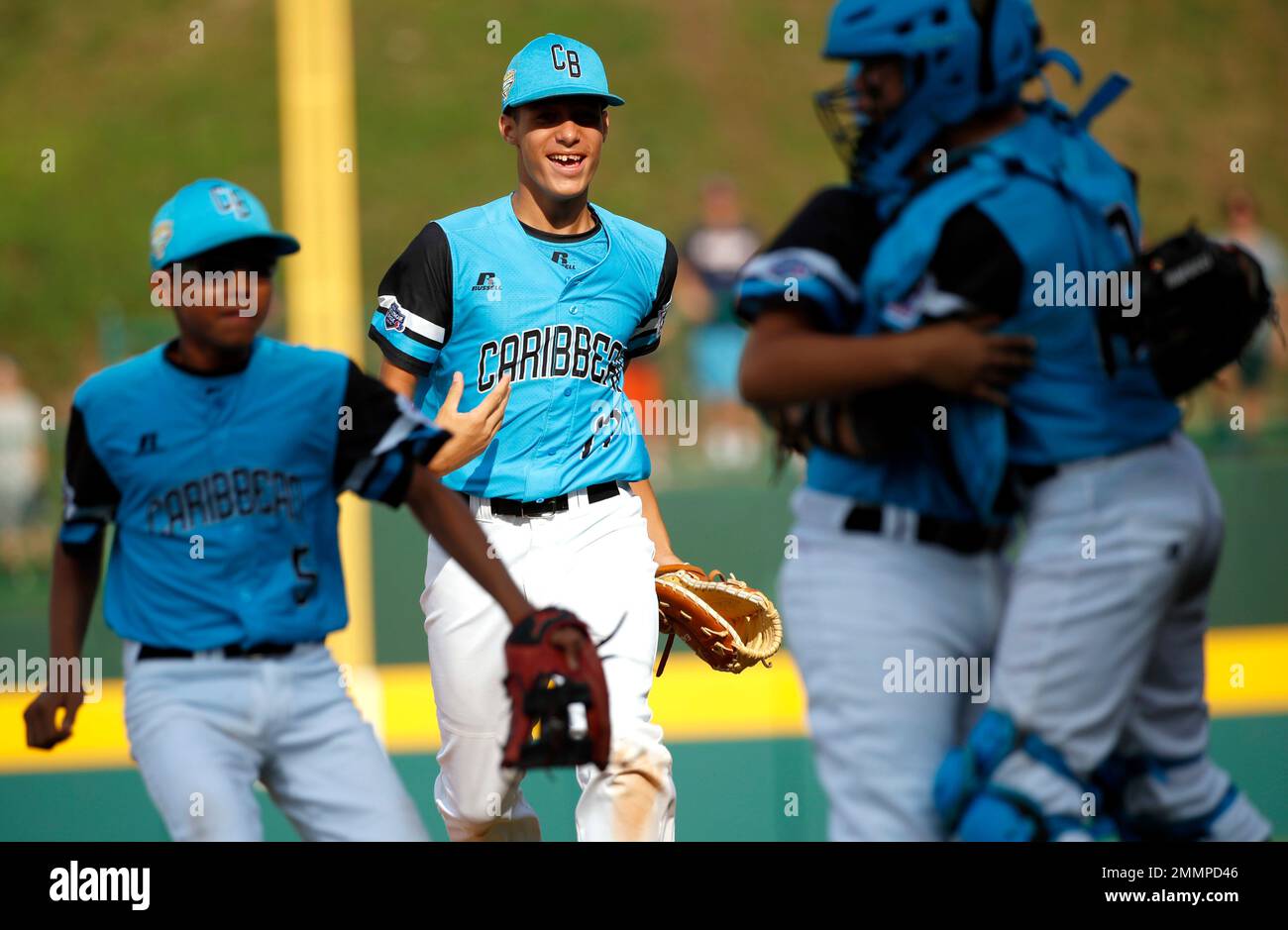 Puerto Rico's first baseman Carlos De Jesus (17) joins the celebration ...