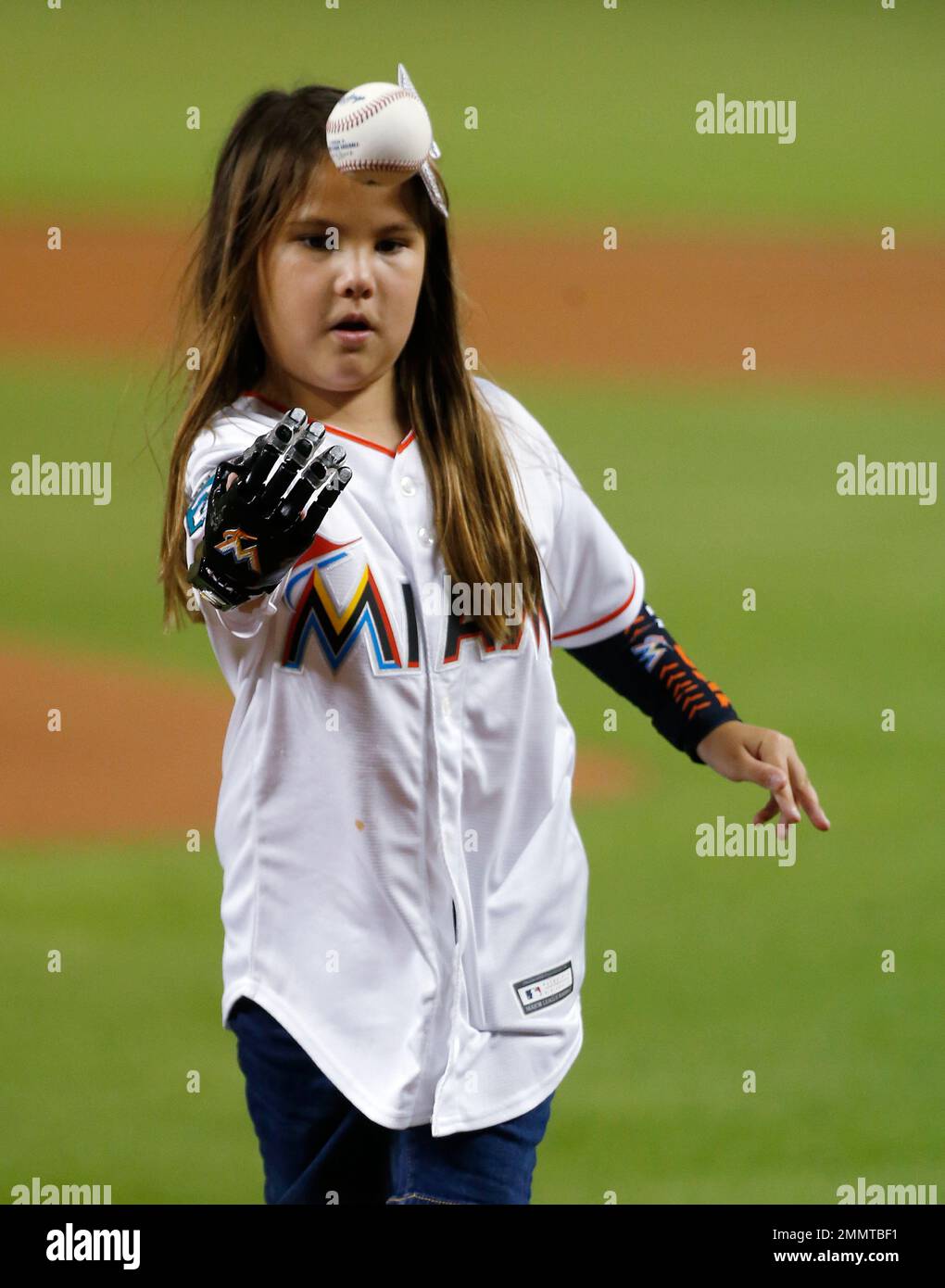 Eight-year-old Hailey Dawson uses her 3D printed robotic hand to throw ...