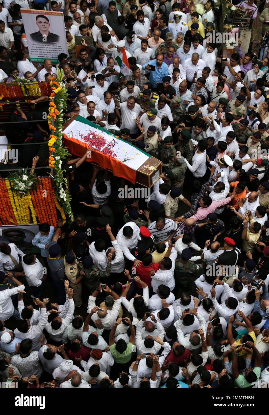People carry the coffin containing the body of Indian Army Major ...