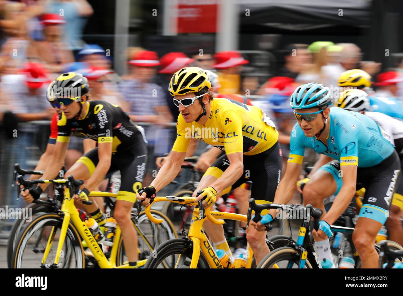 Tour de France winner Britain's Geraint Thomas, center, wearing the ...