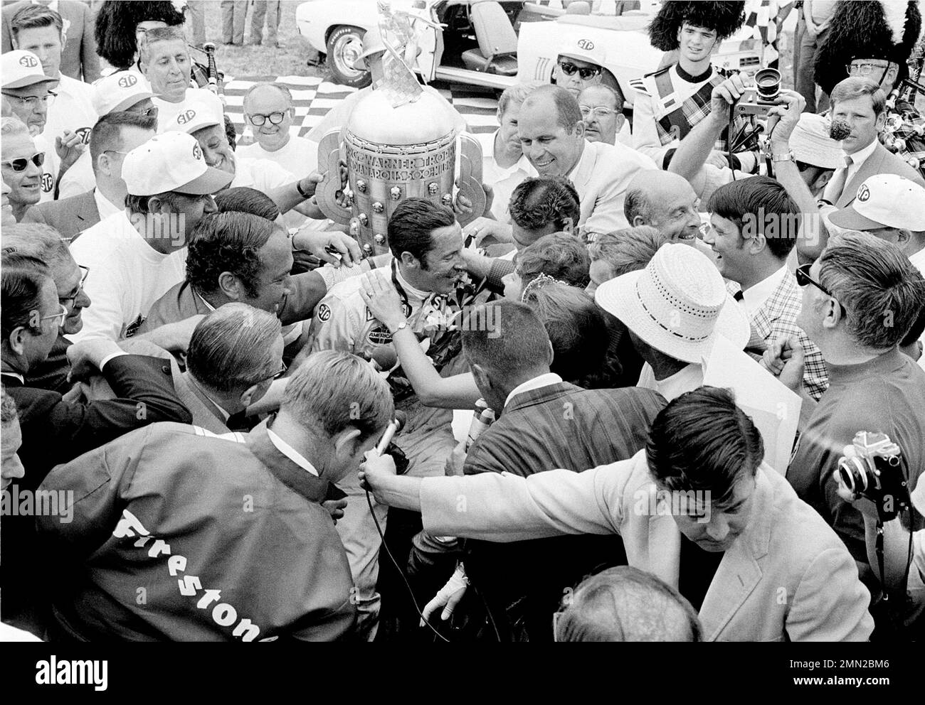 FILE - In this May 30, 1969, file photo, Mario Andretti receives ...