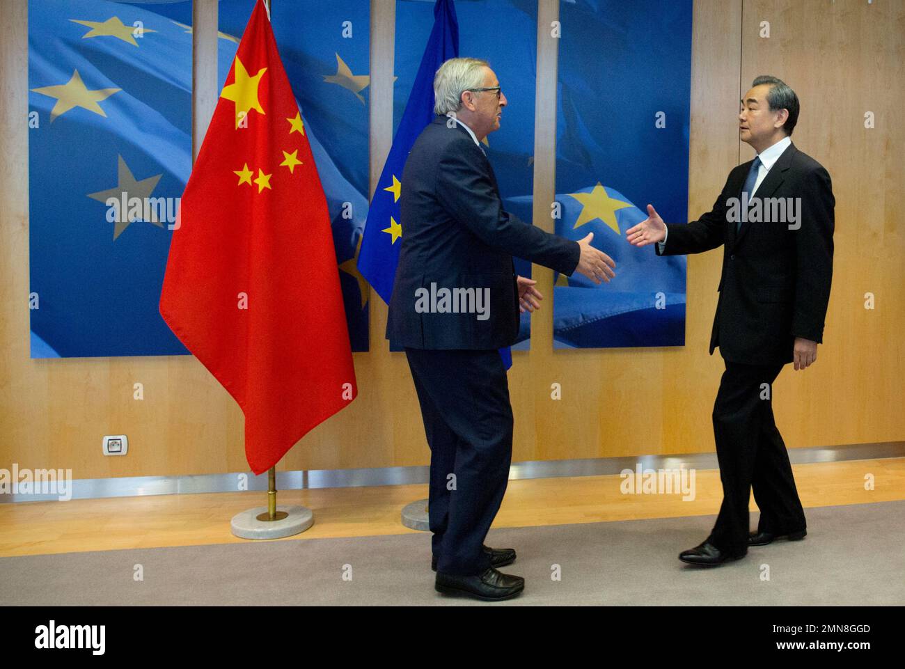 European Commission President Jean-Claude Juncker, left, prepares to shake hands with China's ...